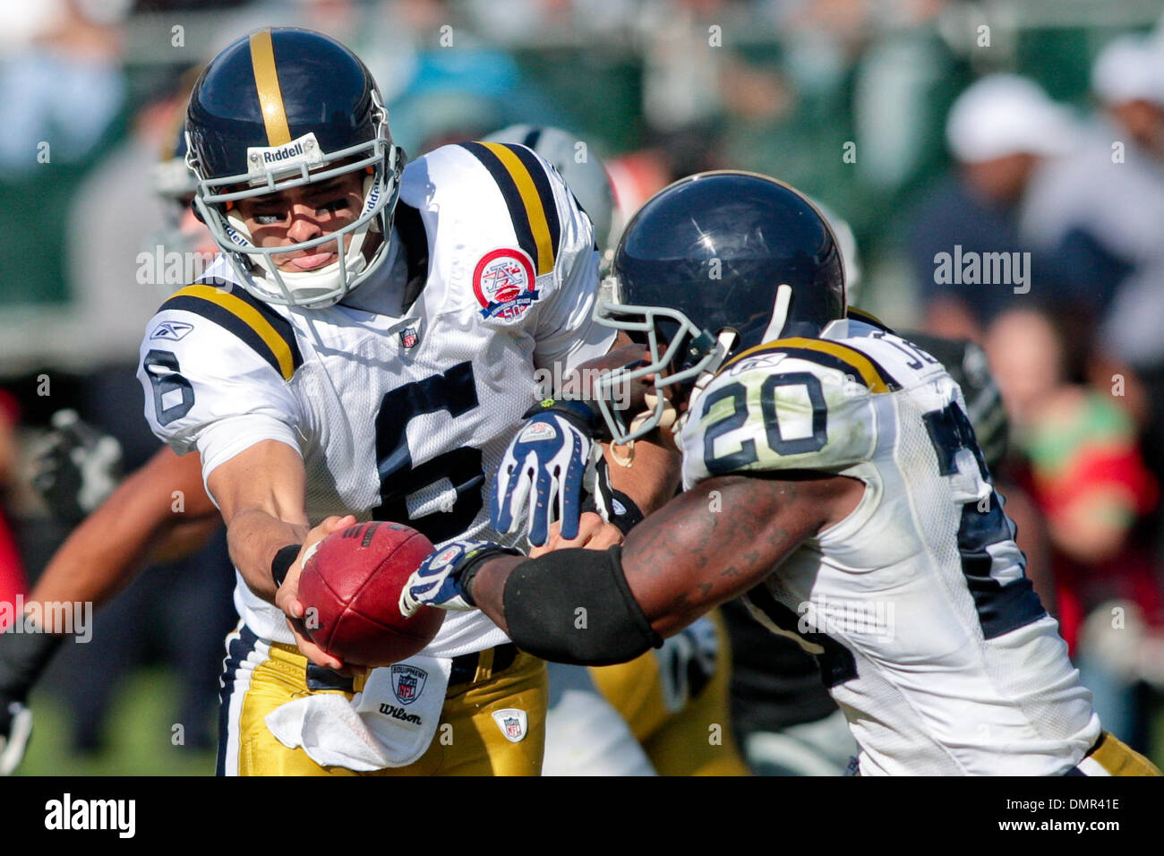 New York Jets Mark Sanchez hands off to New York Jets Thomas Jones (20 ...
