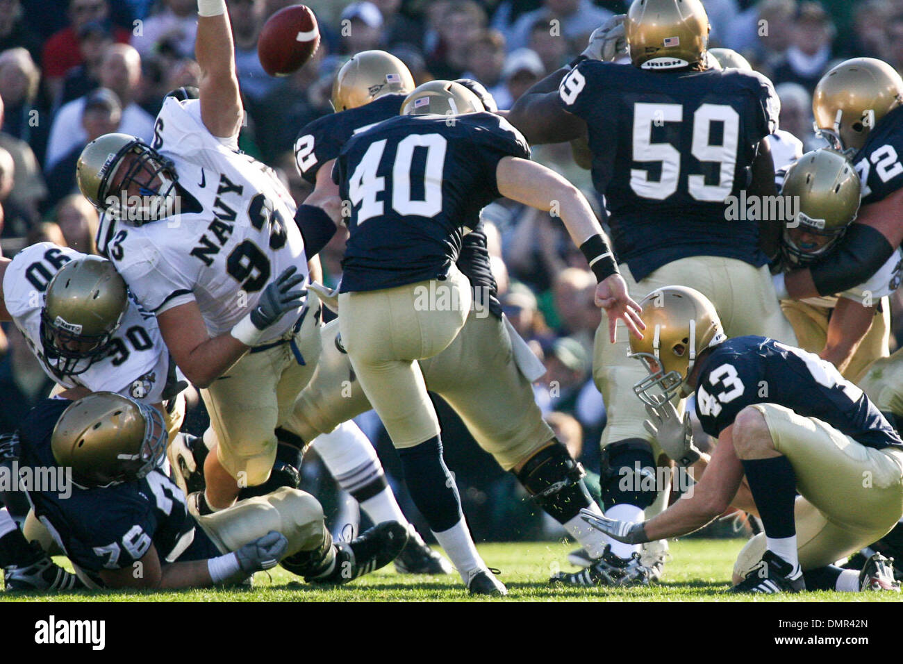 Navy defenders attempt to block a field goal attempt by Notre Dame ...