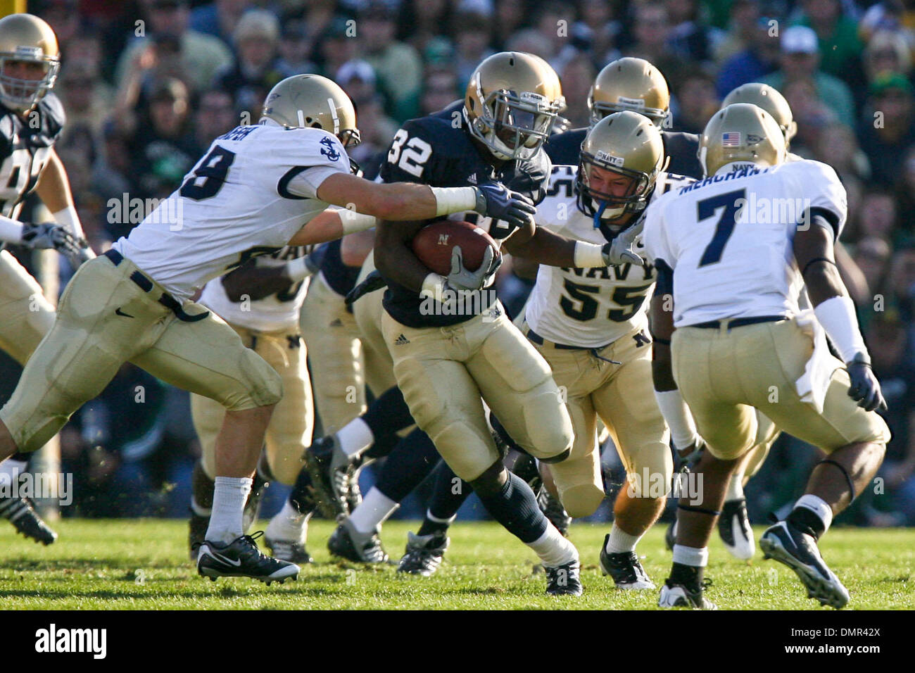 Notre Dame running back Theo Riddick (32) tries to elude the Navy ...