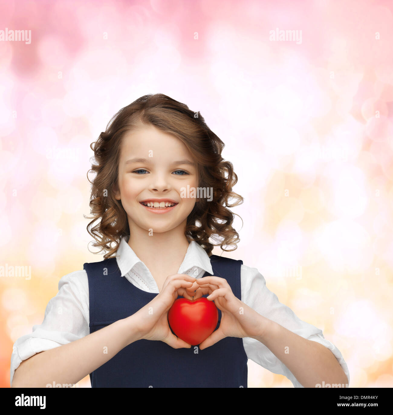 beautiful girl with small heart Stock Photo - Alamy