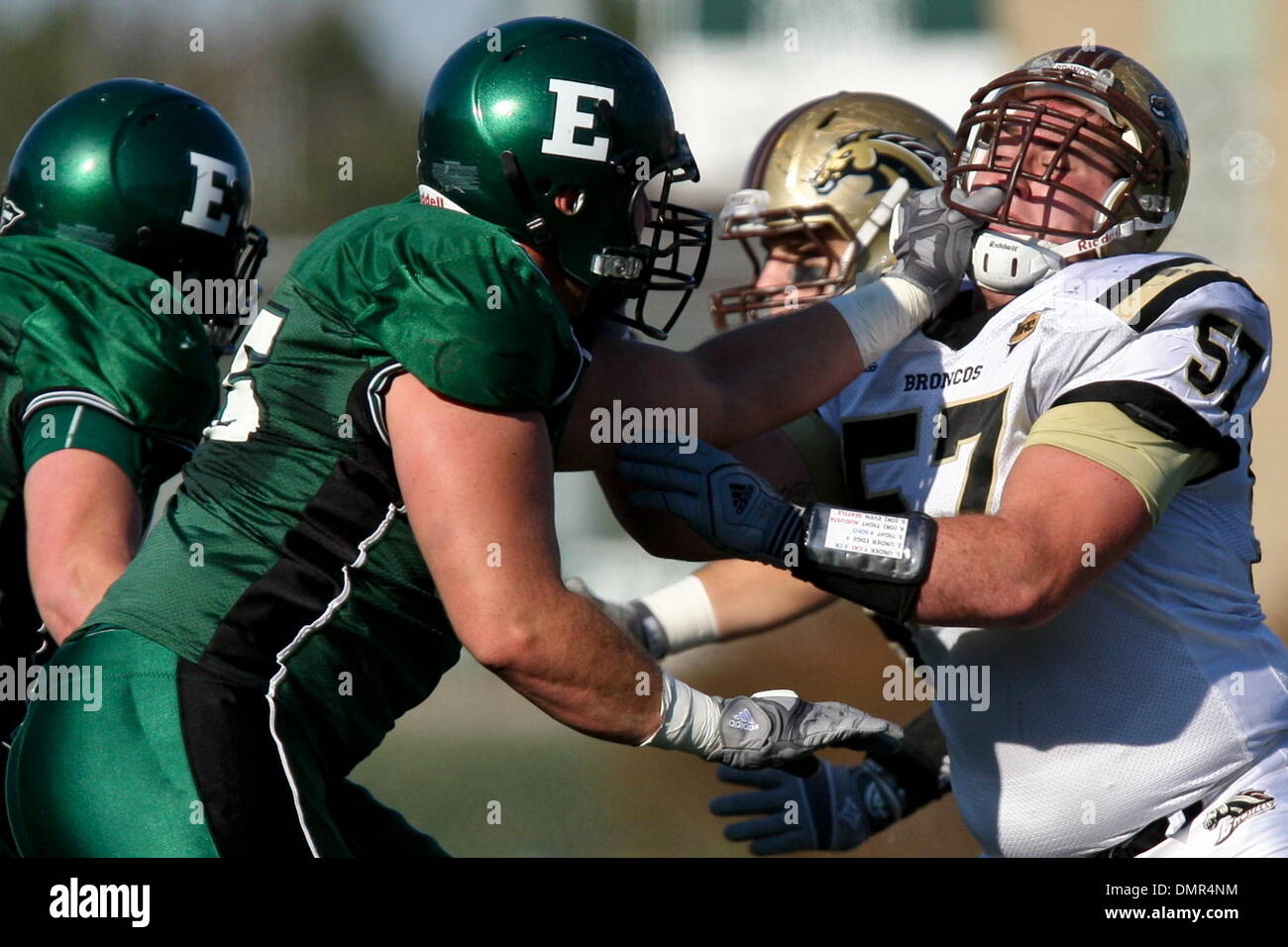 Western Michigan linebacker Tim Fort (57) tries to fight off a block ...