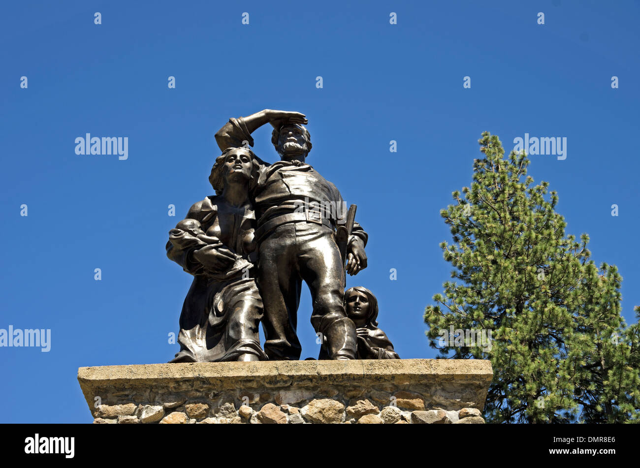 Donner Pass monument, Statue of father, mother, young boy and baby on ...