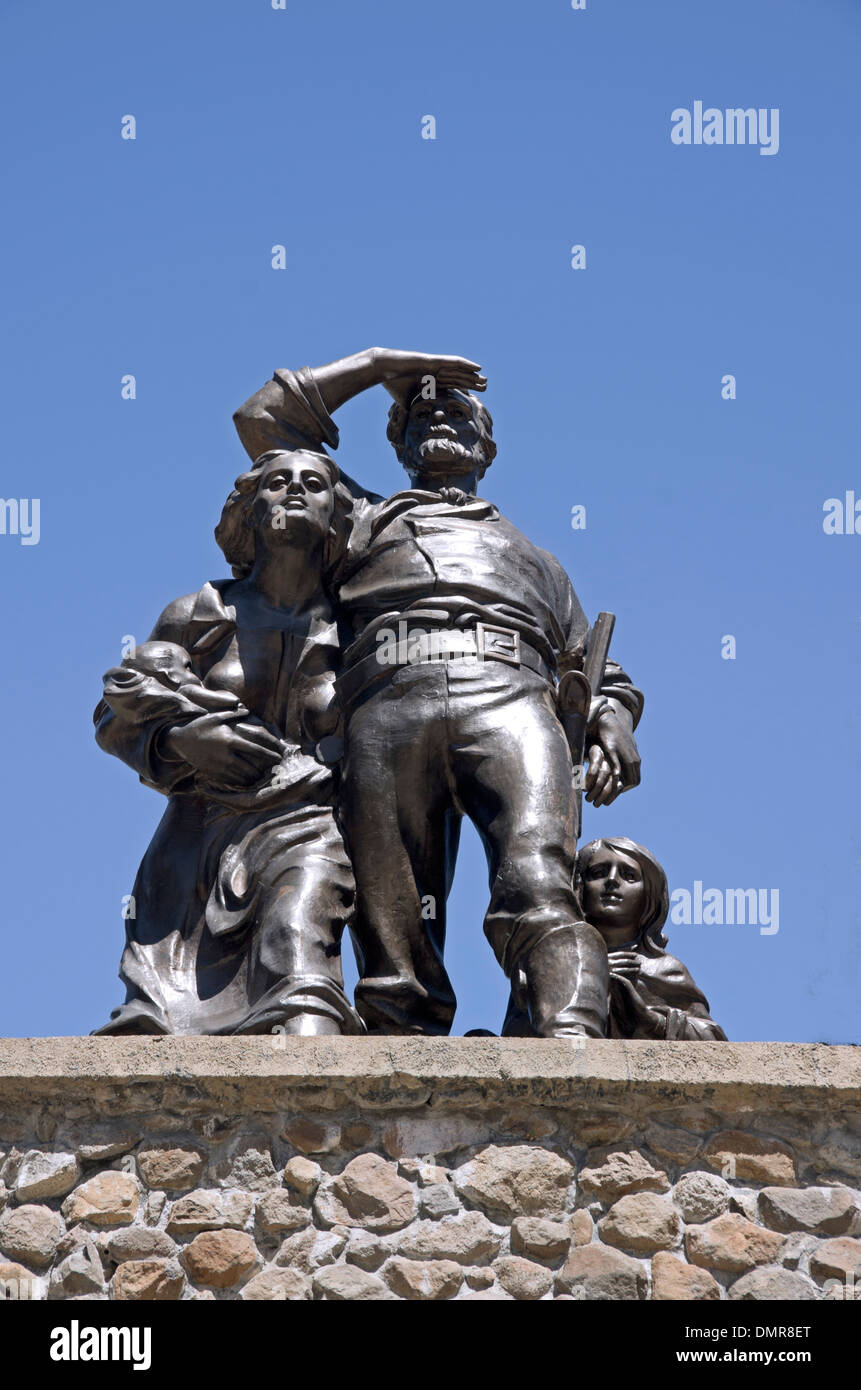 Donner Pass monument, Statue of father, mother, young boy and baby on ...