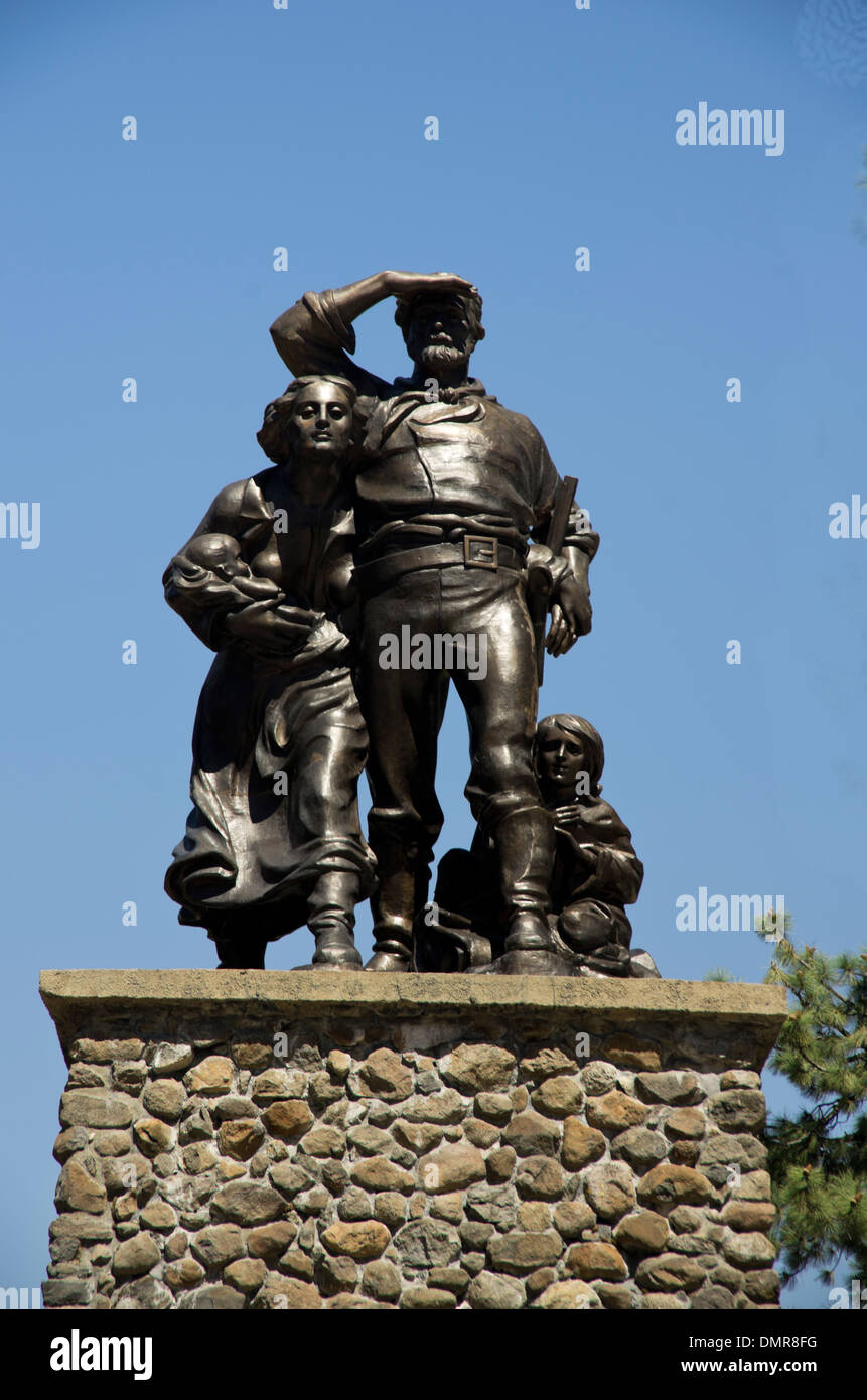 Donner Pass monument, Statue of father, mother, young boy and baby on ...