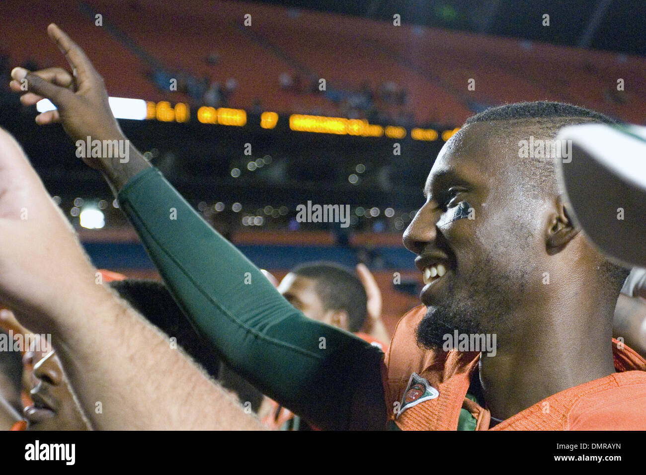 Miami Hurricanes quarterback Jacory Harris (12) gives the number one as ...