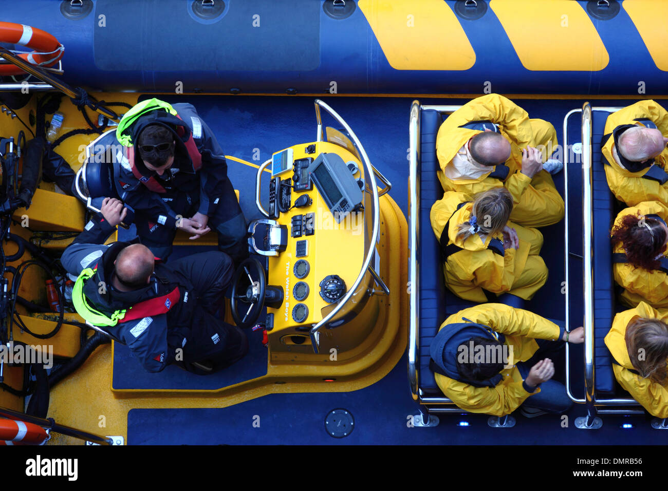 Aerial view of captain, control console and passengers in inflatable ...