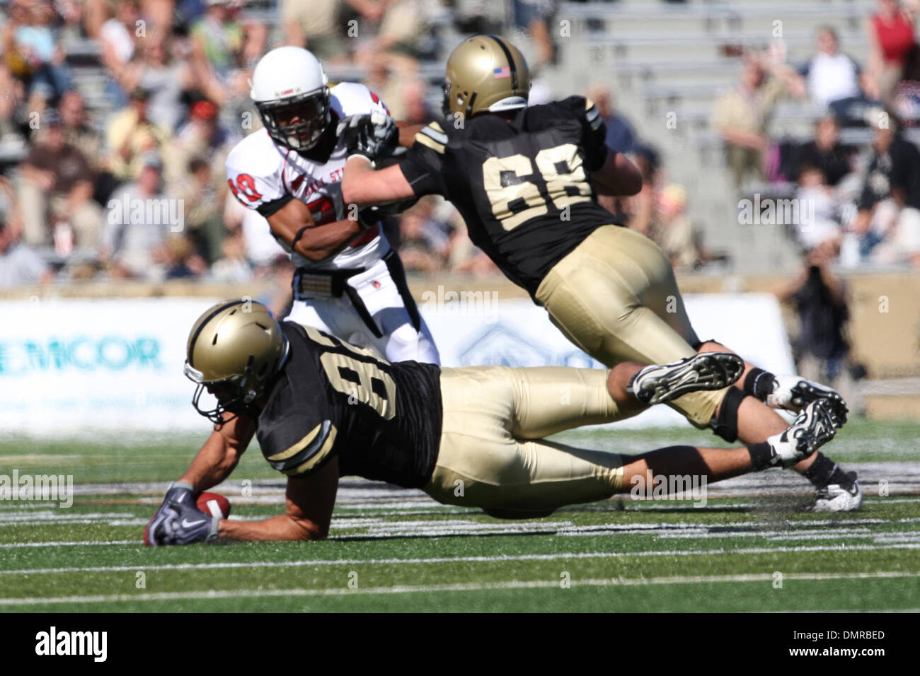 Army wide receiver Ali Villanueva falls on a loose ball while team mate ...