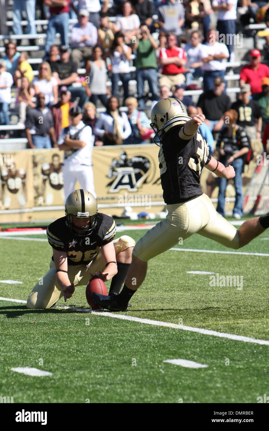 Army kicker Alex Carlton for the extra point while Kolin Walk holds the ...