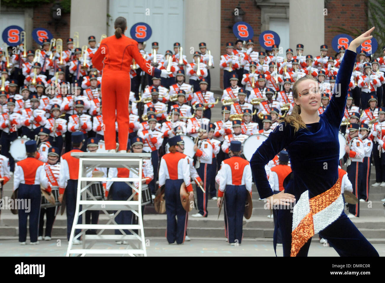 A Syracuse color guard member dances as the band performs on campus ...