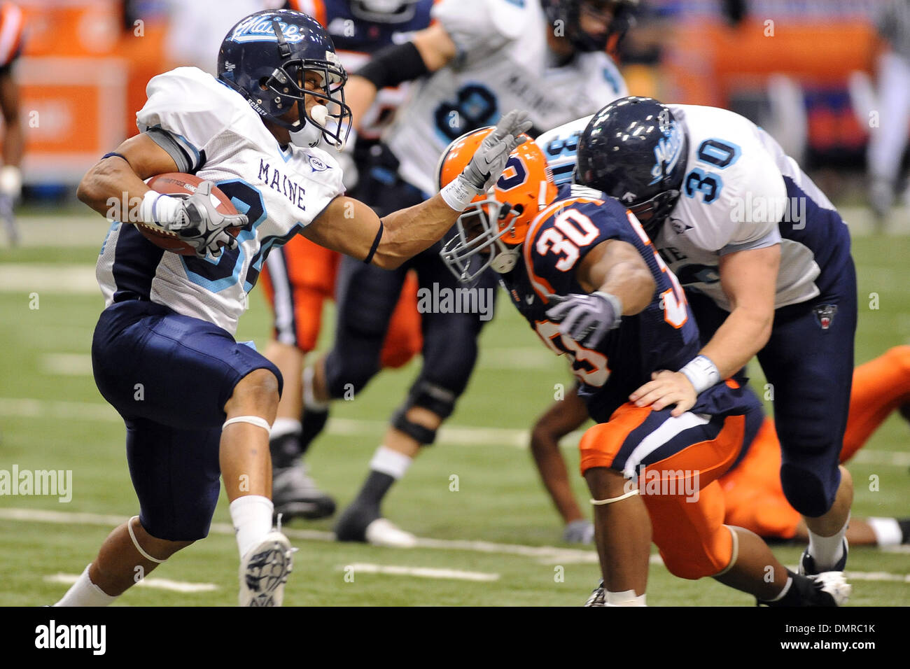 Maine running back Roosevelt Boone takes the kick-off as teammate Maine ...