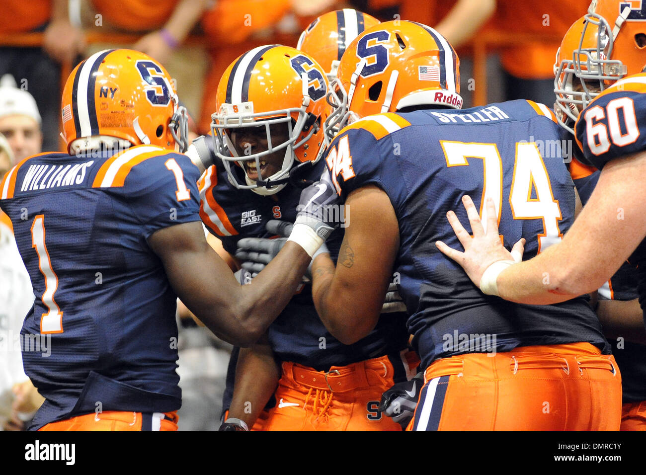 Syracuse wide receiver Marcus Sales is mobbed by teammates after ...