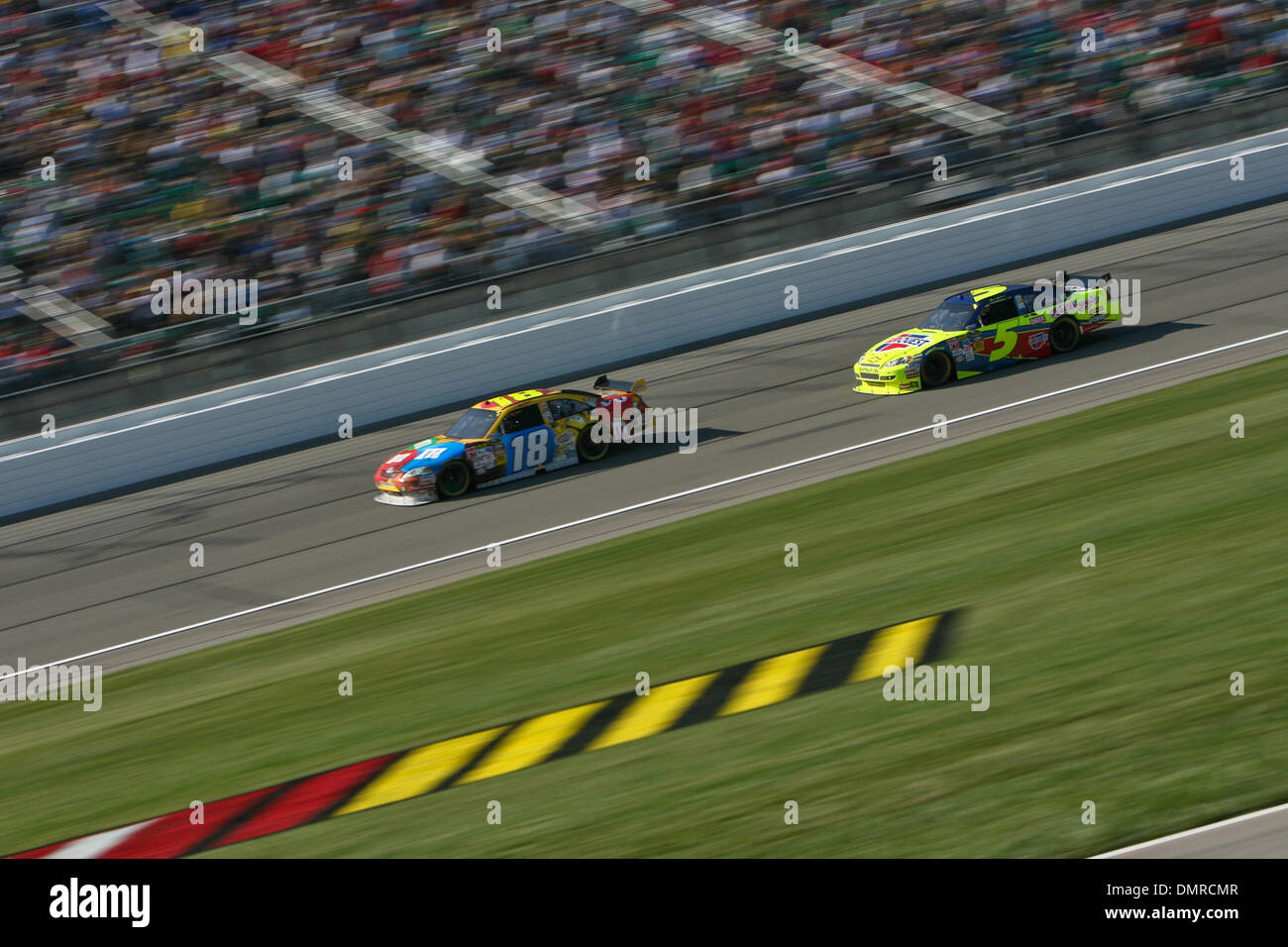 04 October 2009: Kyle Busch No. 18 races Mark Martin No. 5 down the ...