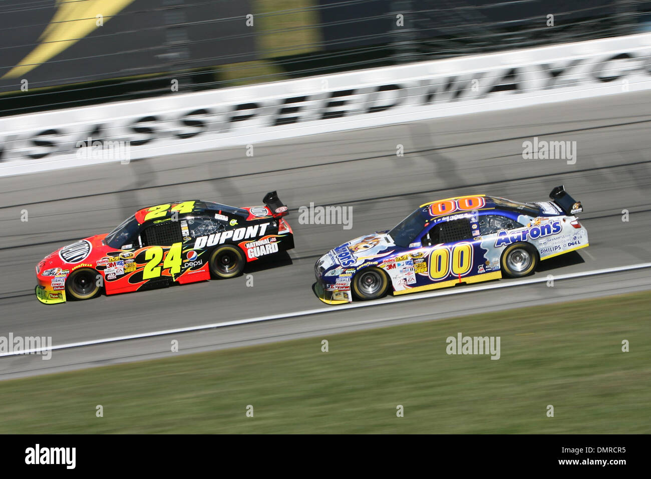 04 October 2009: Jeff Gordon #24 races David Reutimann #00 during the ...