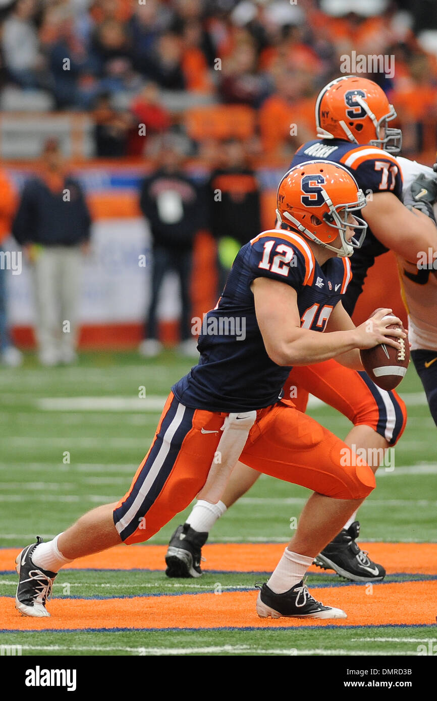 Syracuse quarterback Ryan Nassib scrambles out of the pocket in the ...