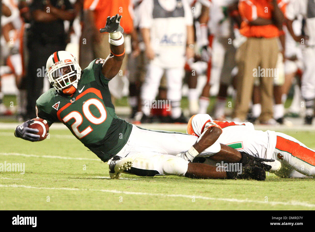 Miami (FL) running back Damien Berry (20) is tackled by a Florida A&M ...