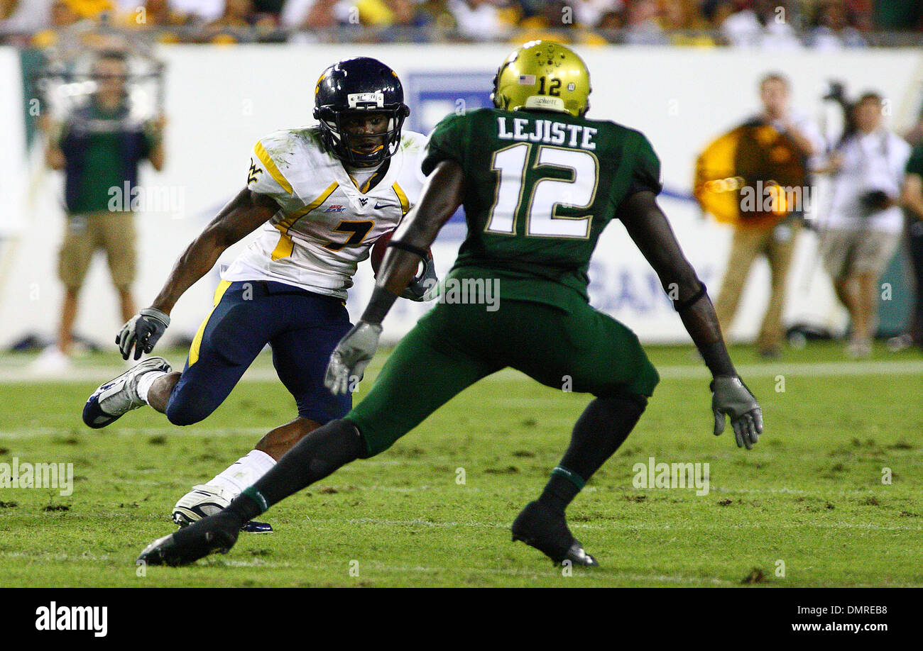 West Virginia running back Noel Devine #7 tries to avoid being tackled ...