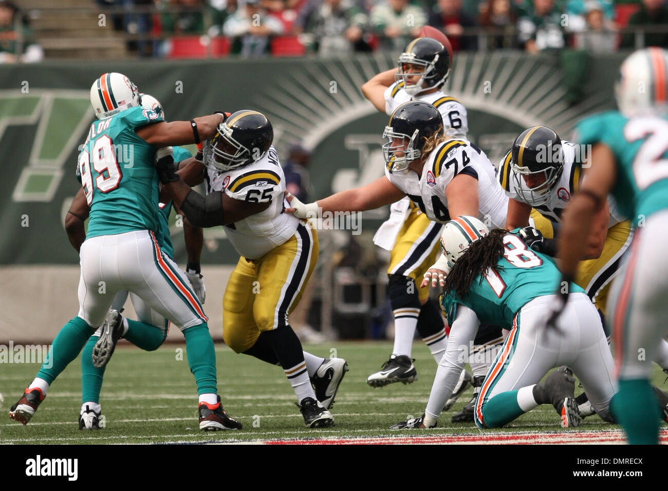 New York Jets #74 Nick Mangold keeps Mark Sanchez safe. The Miami ...