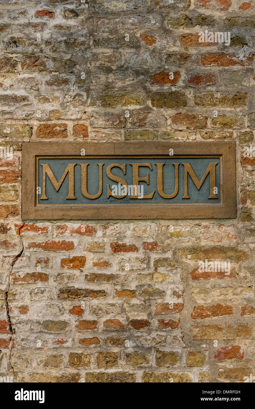Vintage metal museum sign inlaid in a brick wall Stock Photo - Alamy