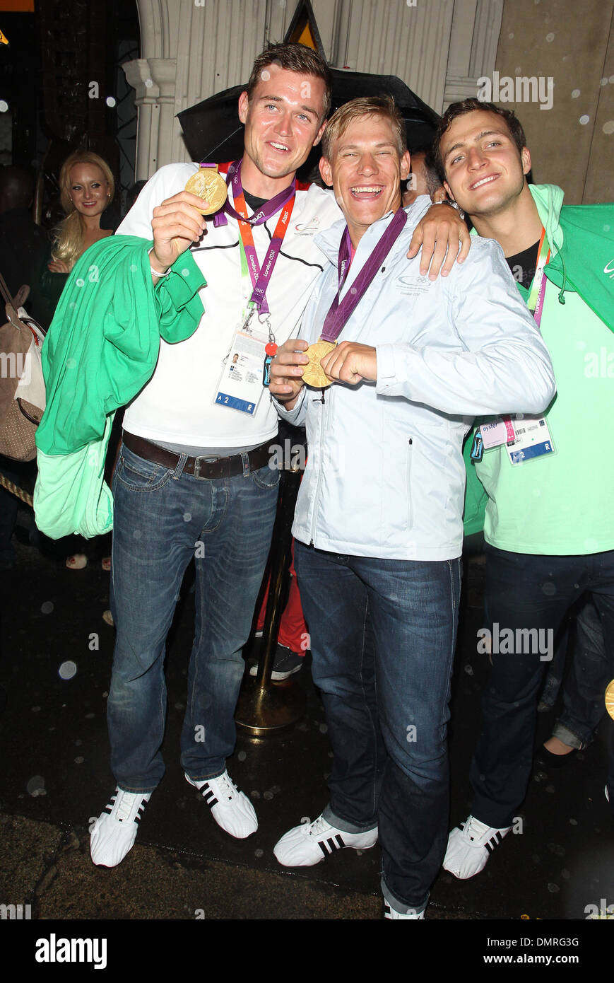 Members of German Olympic rowing team showing off their medals as they ...