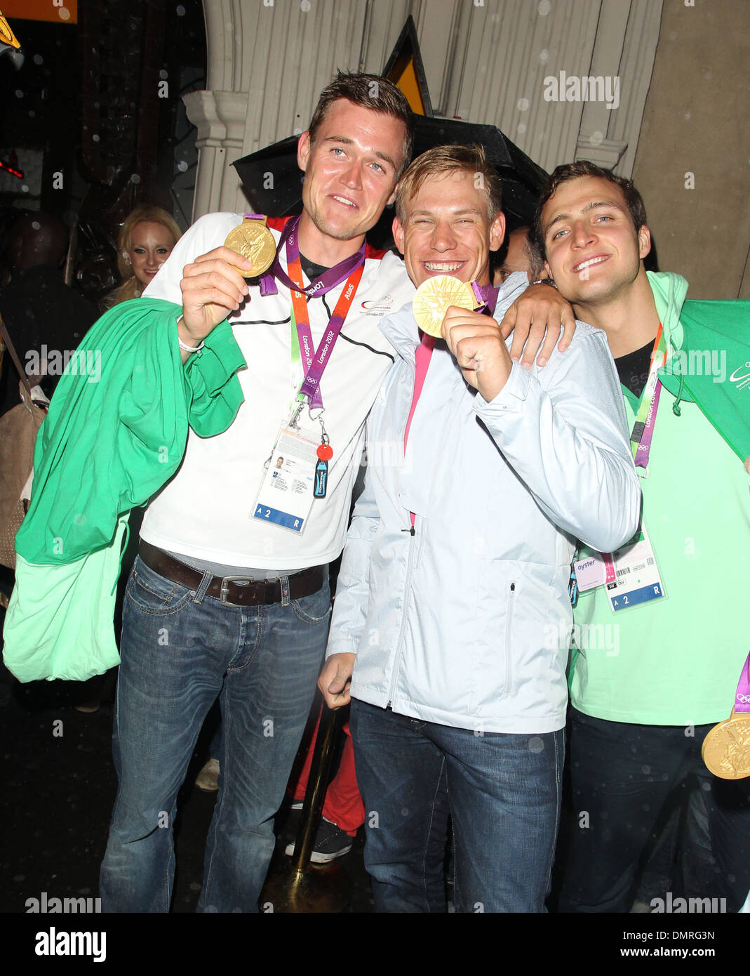 Members of German Olympic rowing team showing off their medals as they ...