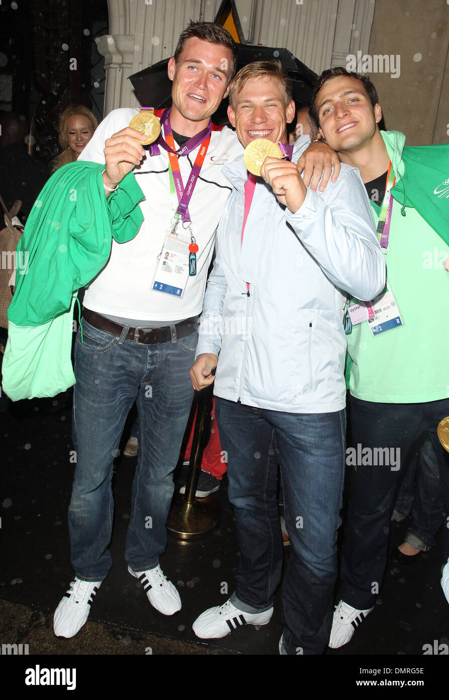 Members of German Olympic rowing team showing off their medals as they ...