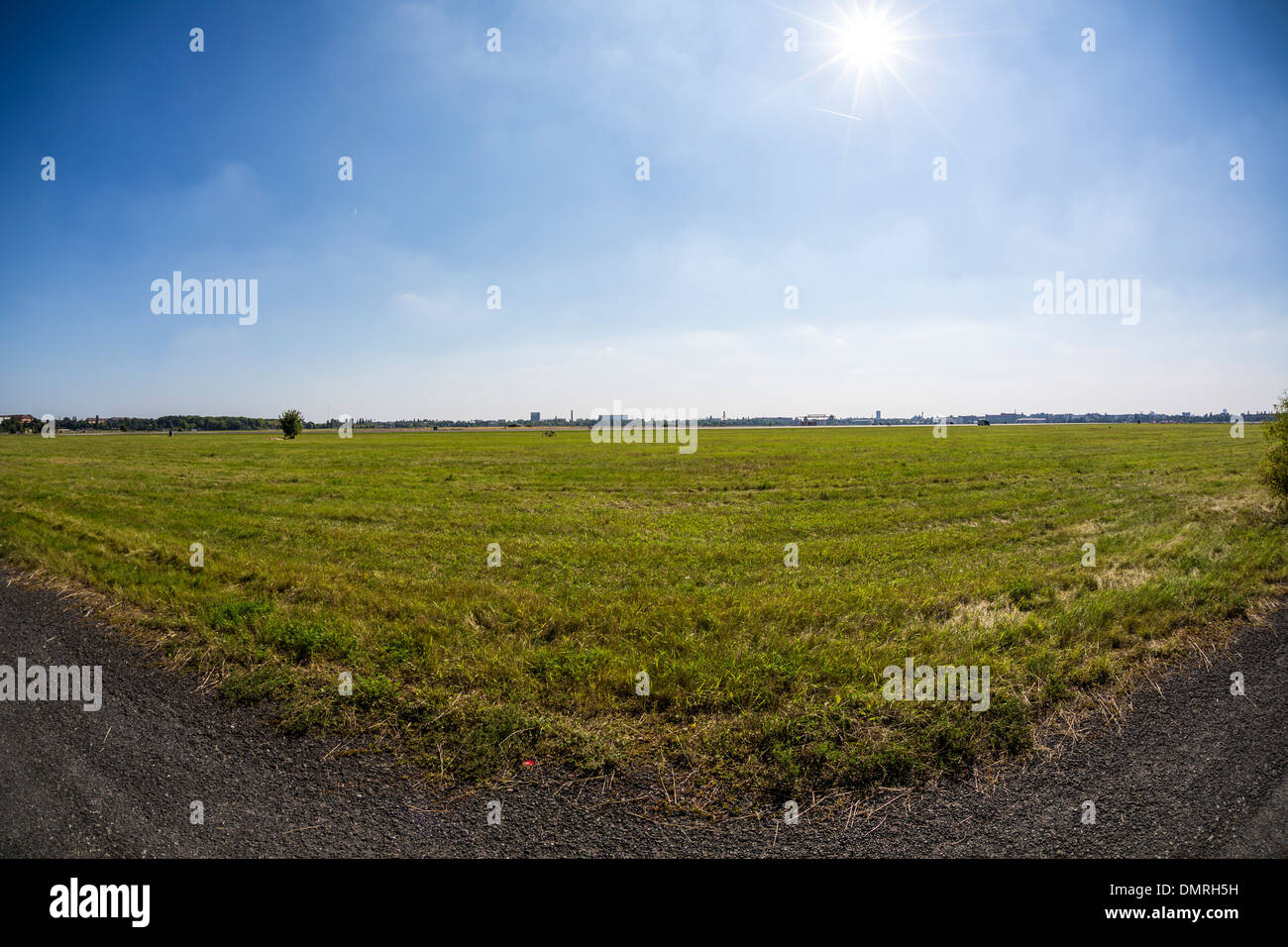wide meadow with blue sky and sun, shoot in Berlin Germany Stock Photo ...