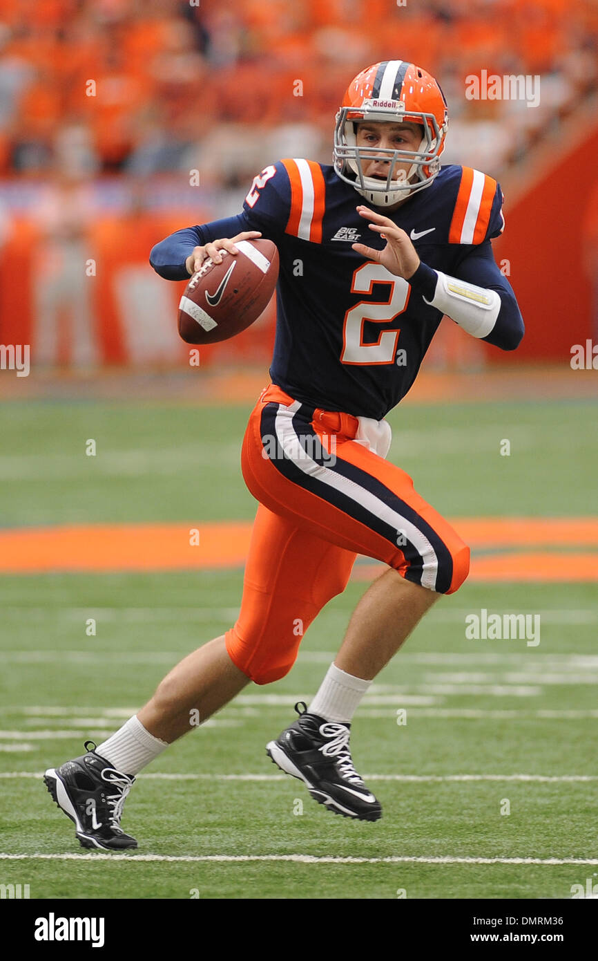 Syracuse Orange quarterback Greg Paulus scrambles as he looks for an ...