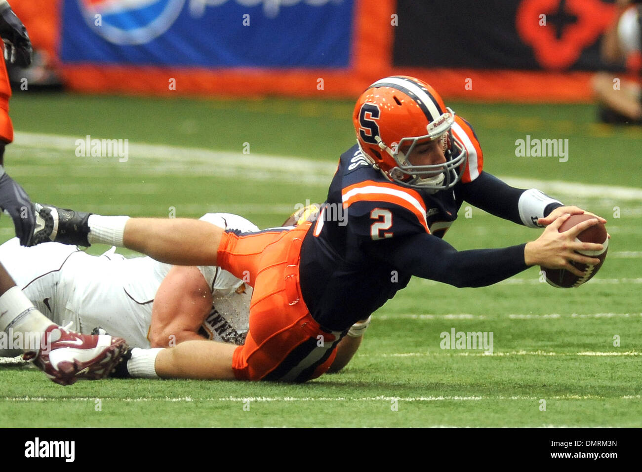 Syracuse quarterback Greg Paulus dives for an apparent first down in ...