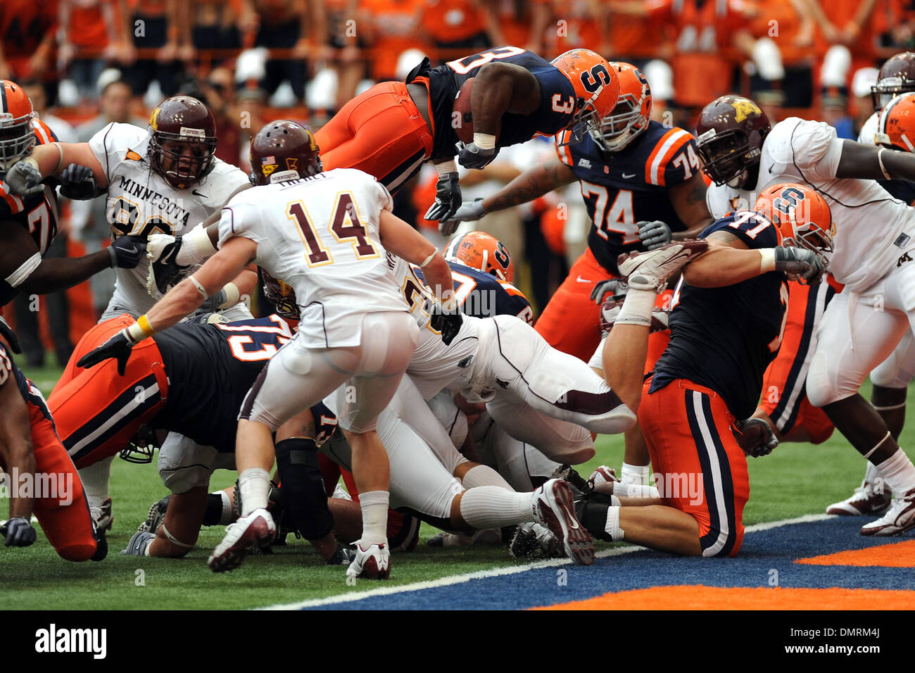 Syracuse running back Delone Carter ,3, goes airborne to score the ...