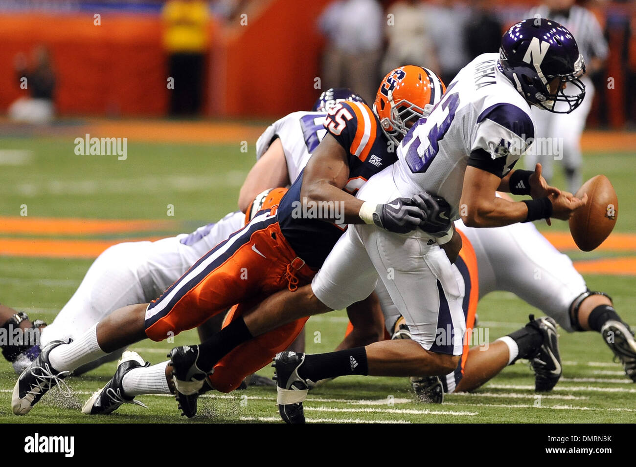 Syracuse linebacker Derrell Smith (25) causes Northwestern quarterback ... Syracuse linebacker Derrell Smith (25) causes Northwestern quarterback ...