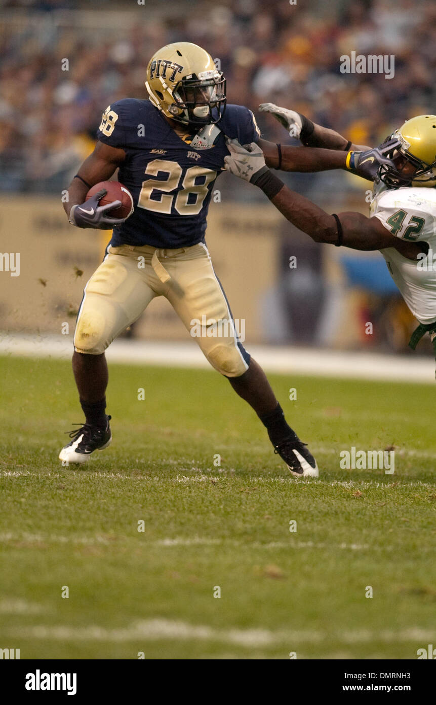 Pittsburgh Panthers running back Deon Lewis (28) gives a stiff arm to ...