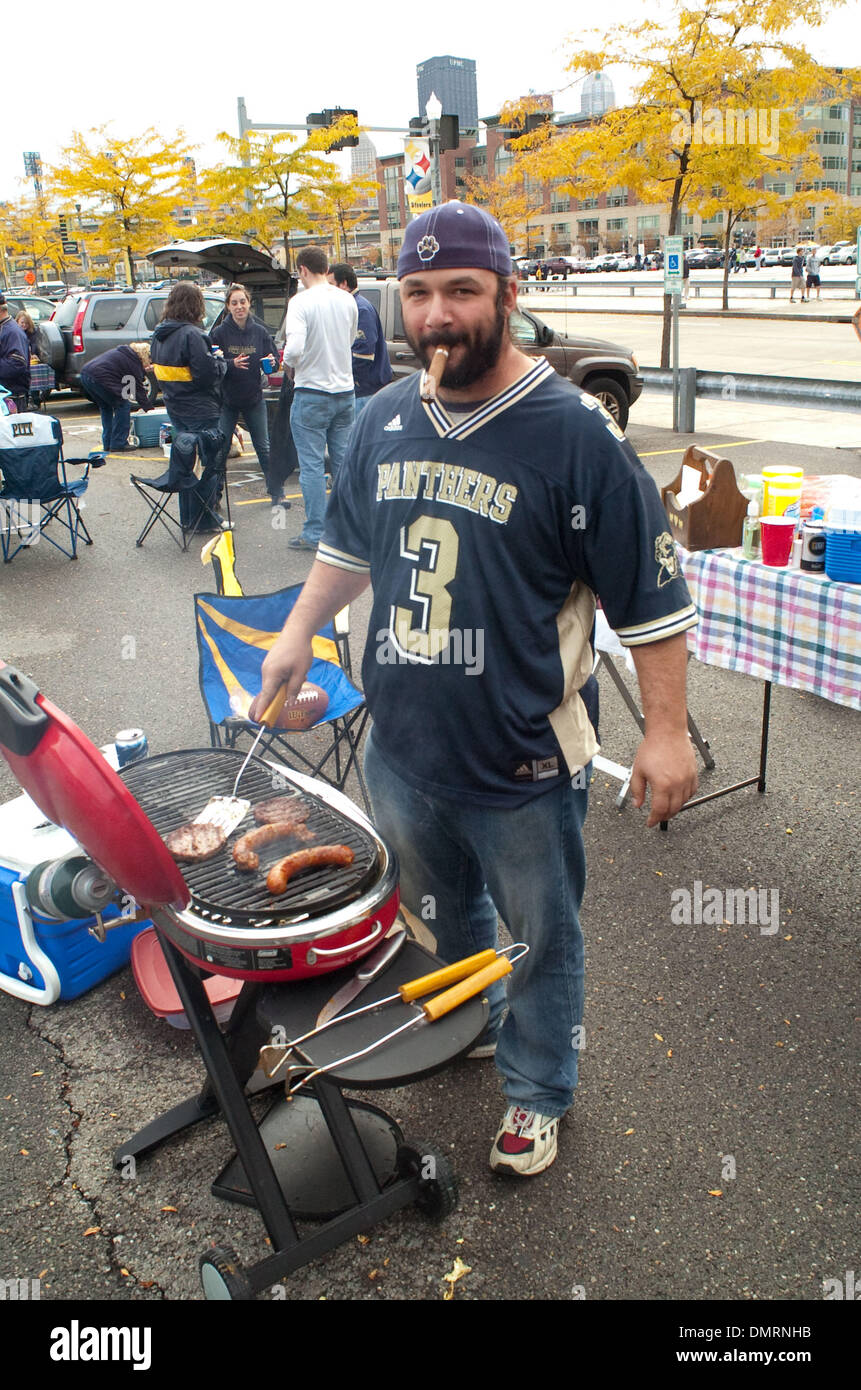 A Pittsburgh Panthers fan at his grill for a tailgate party prior to a ...