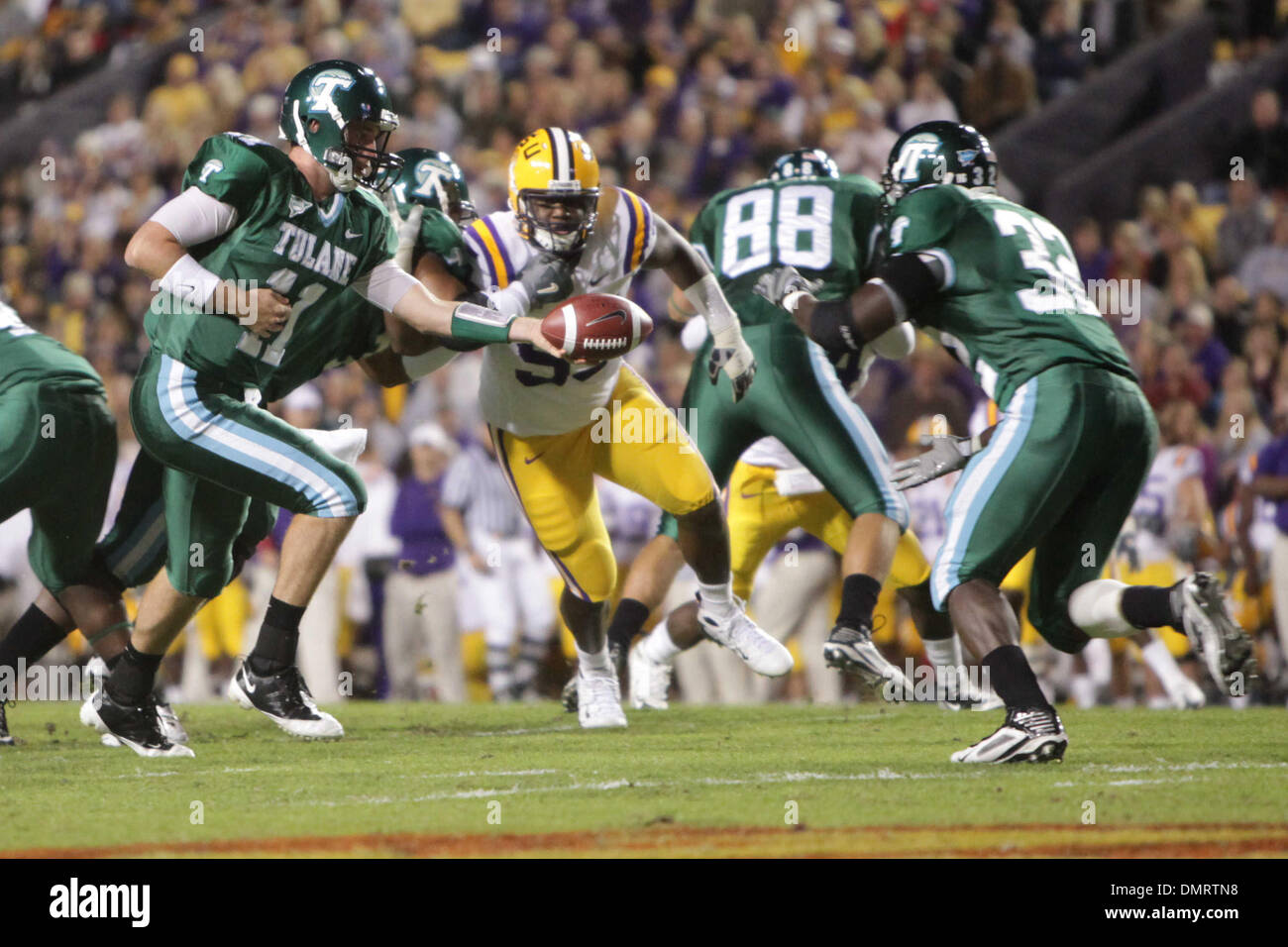 Tulane quarterback Ryan Griffin (11) hands off during the game between ...