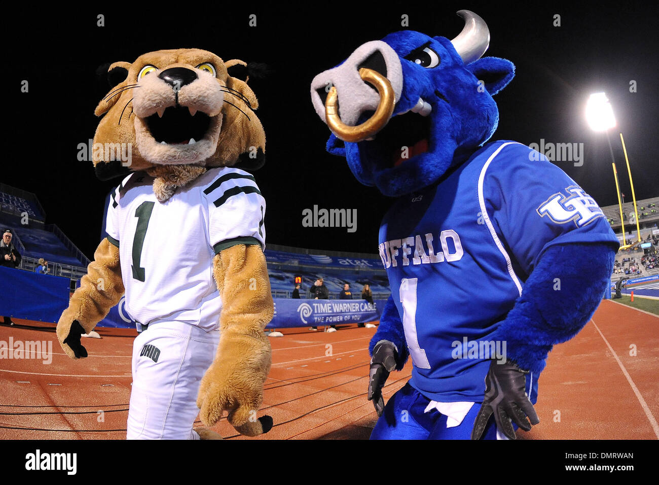 The Ohio mascot (left) along with Buffalo's mascot walk the sideline ...