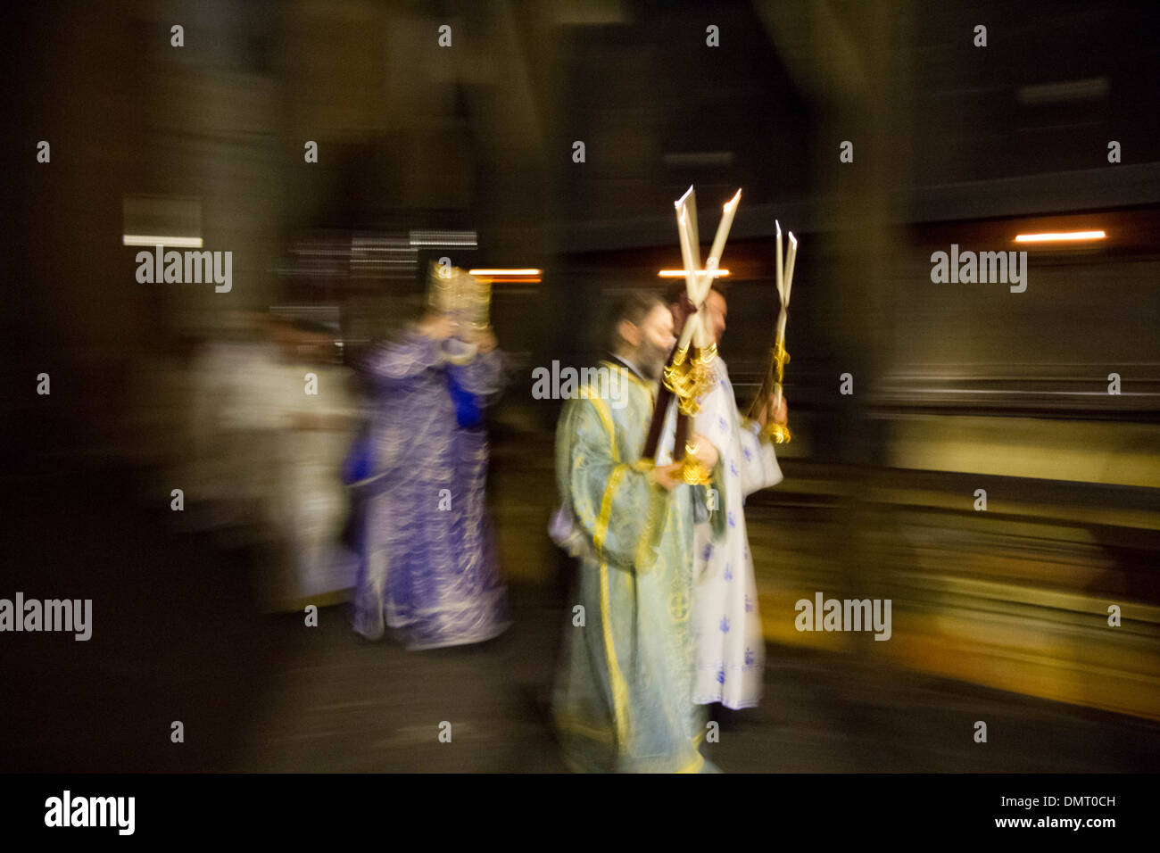 Orthodox Christian priests performing a night liturgy around the ...