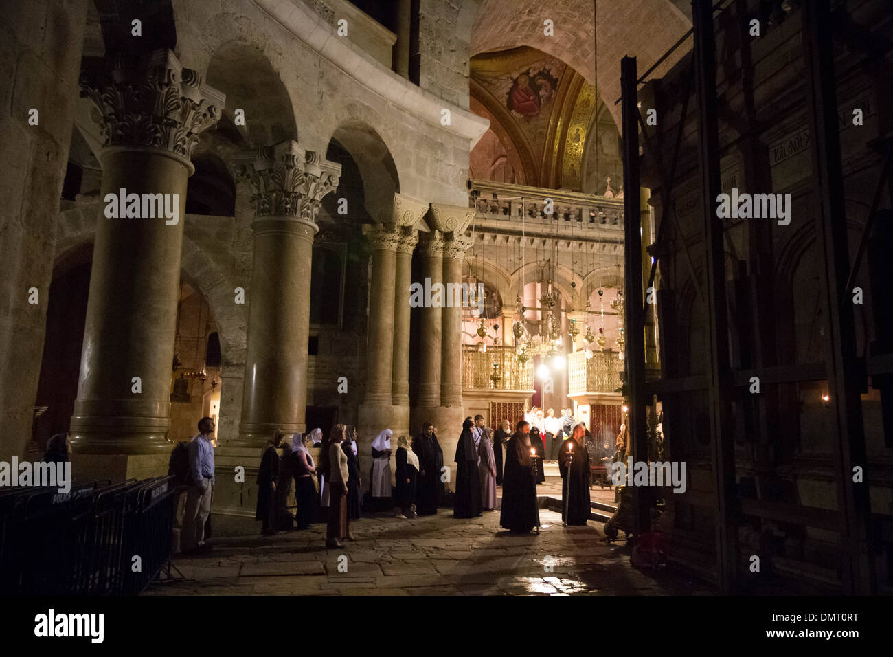 Orthodox Christian priests performing a night liturgy around the ...