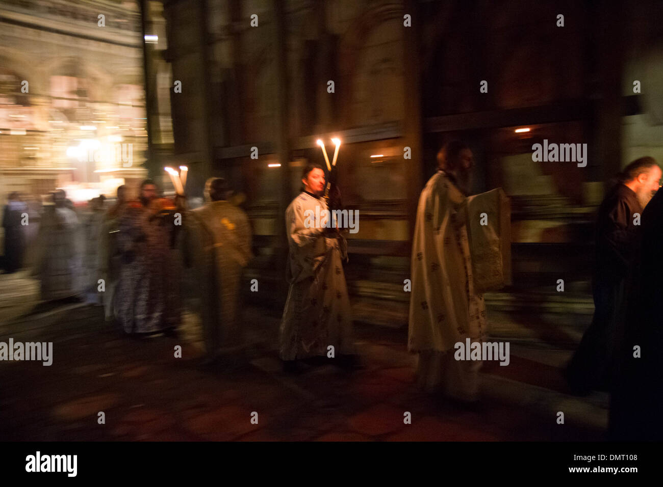 Orthodox Christian priests performing a night liturgy around the ...