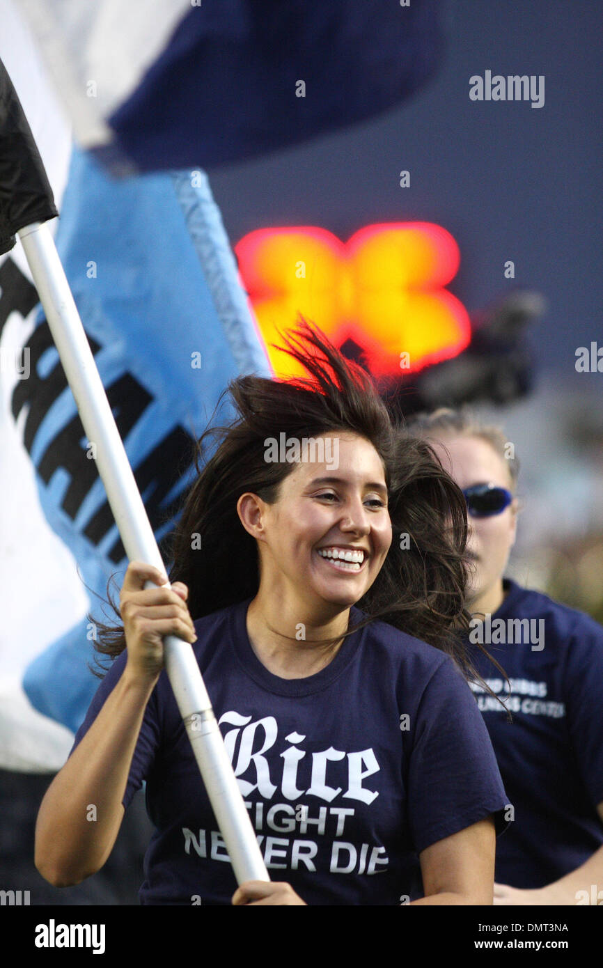 Rice cheerleader waving a rice flagbefore the start of the game at Rice ...