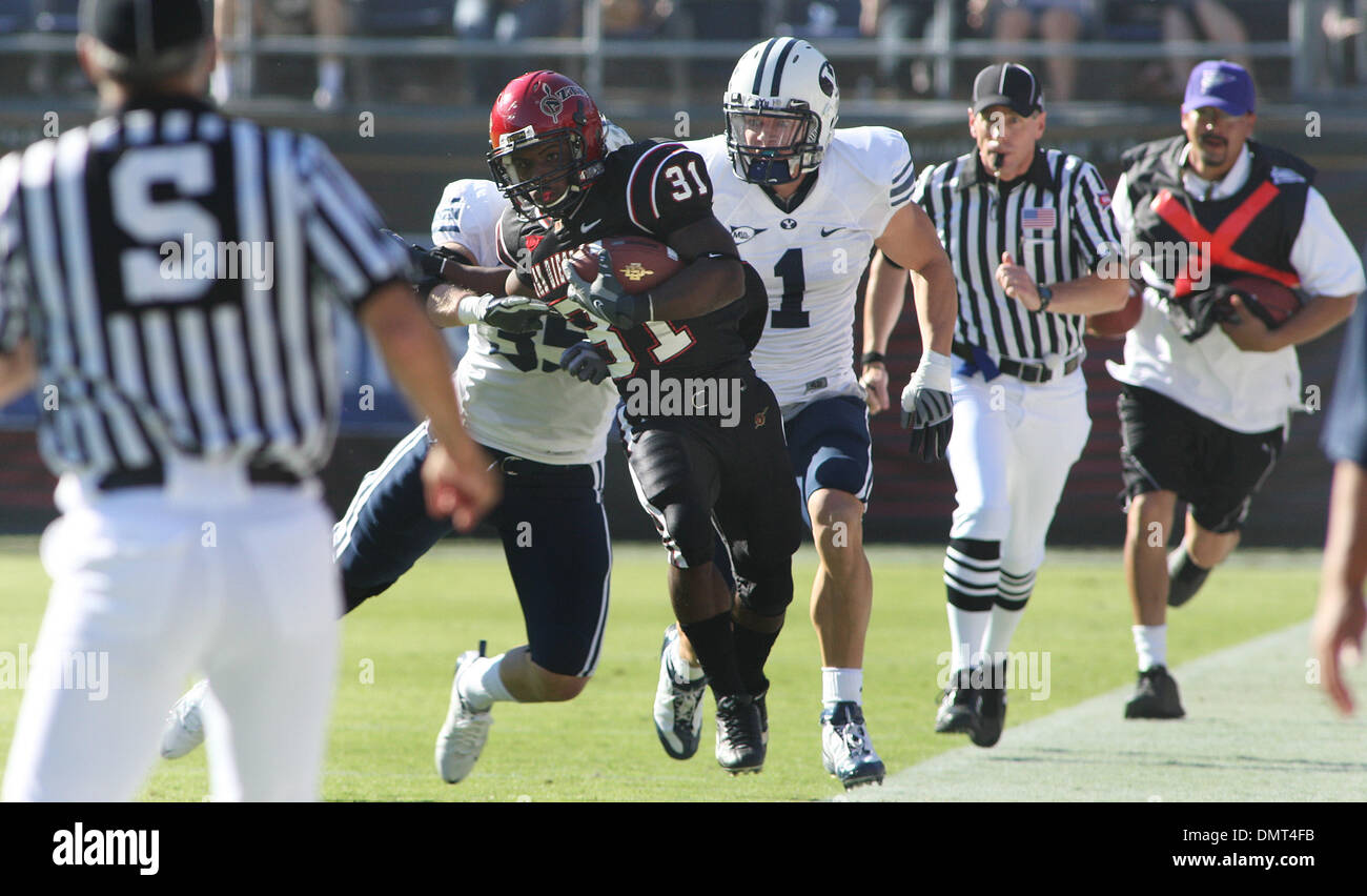 San Diego State Aztec running back Wlater Kazee is forced out of bounds ...