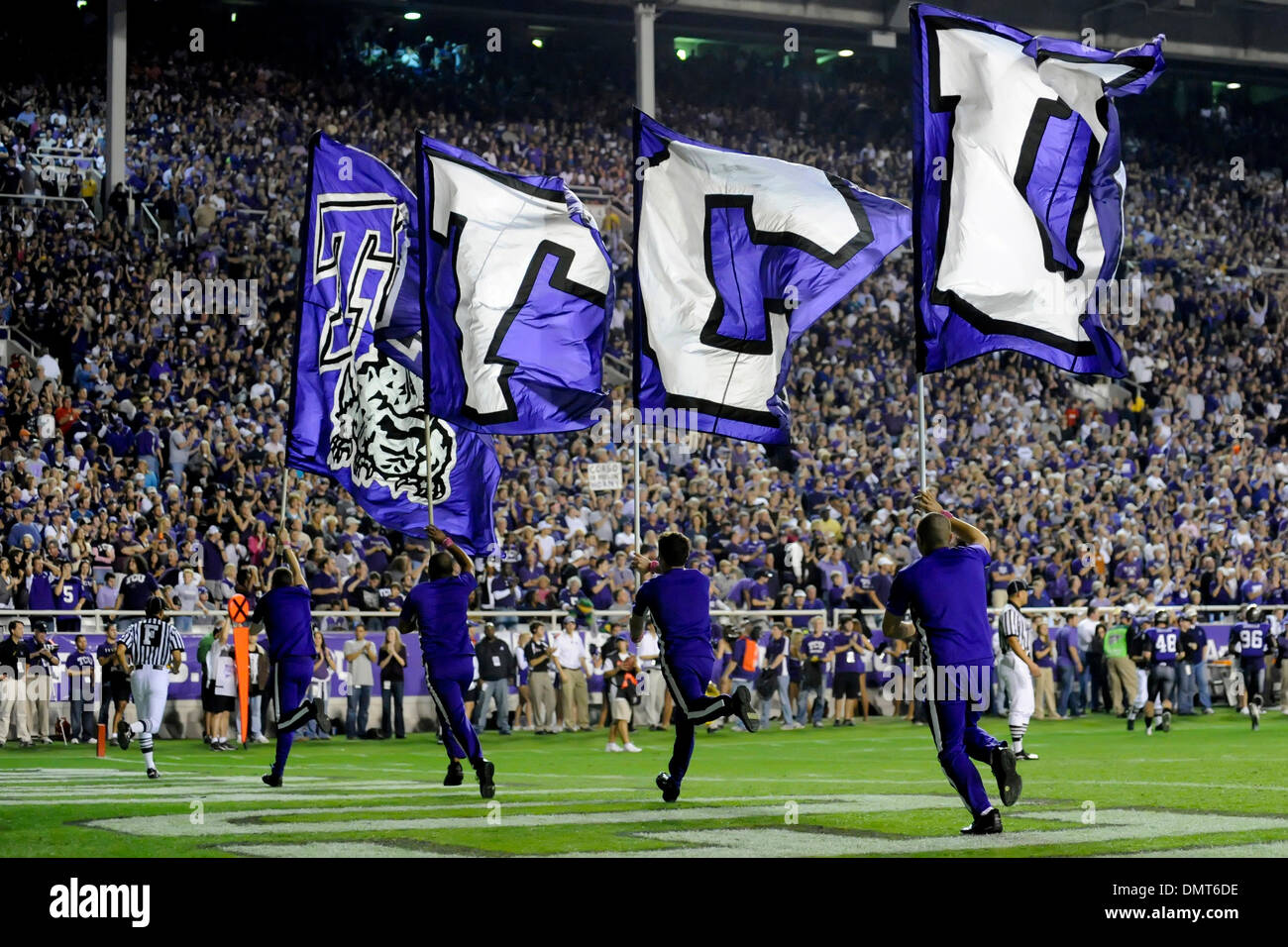 The TCU cheerleaders run the flags as the #4 Texas Christian Horned ...