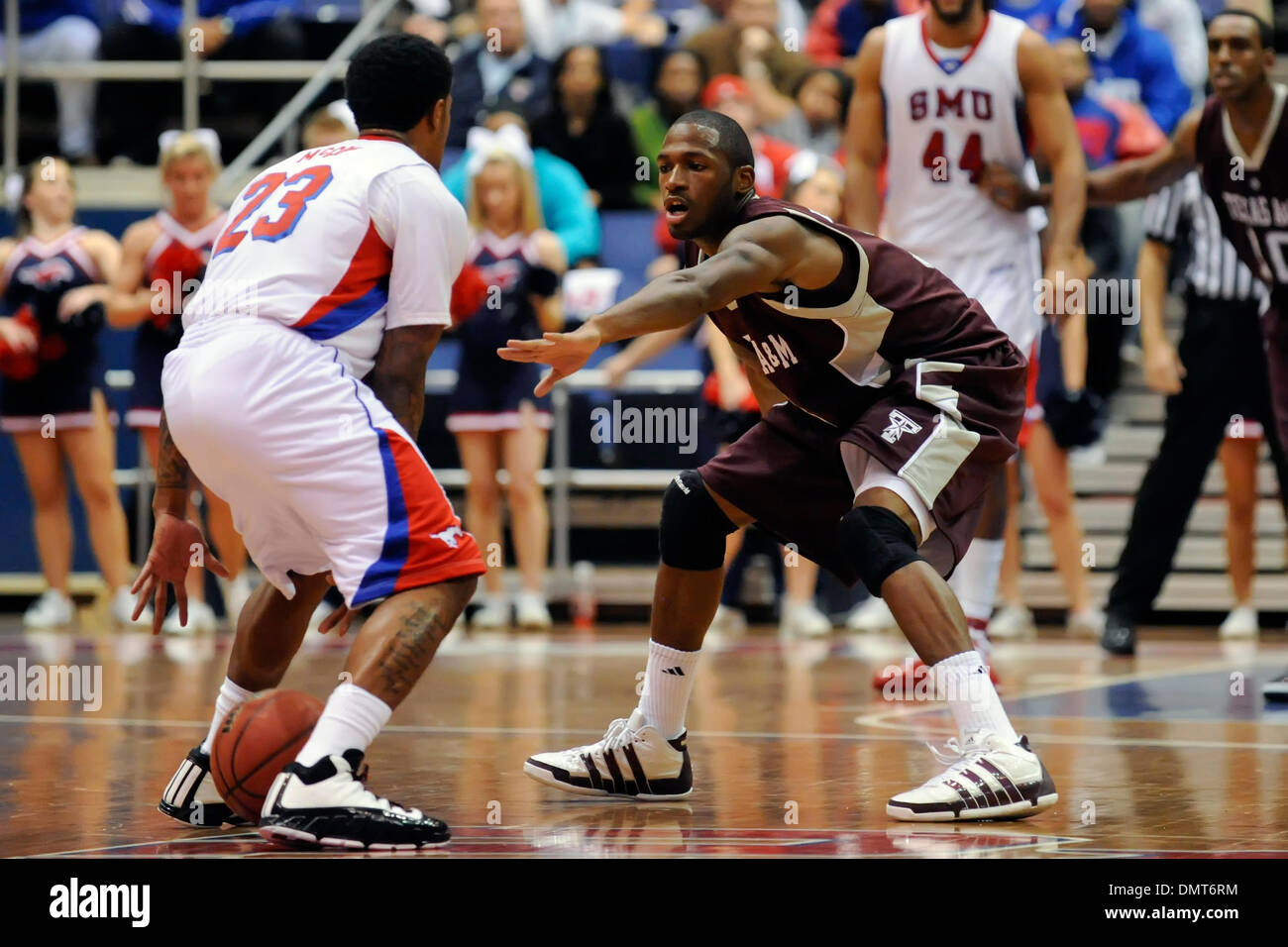 Texas A&M Guard Donald Sloan defends against Paul McCoy as the Texas ...