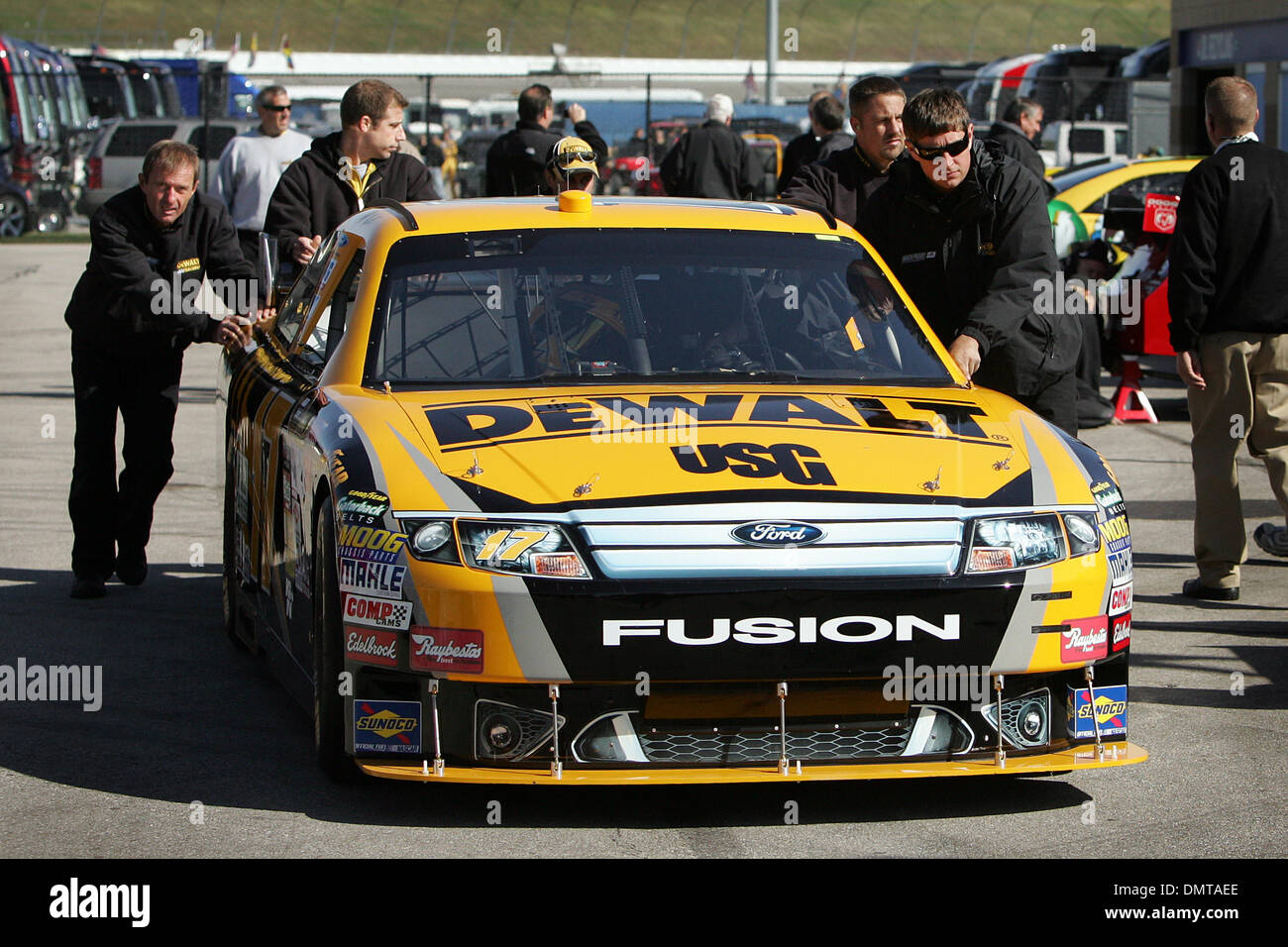 The DeWalt Ford garage crew pushes Matt Kenseth's car back to the ...