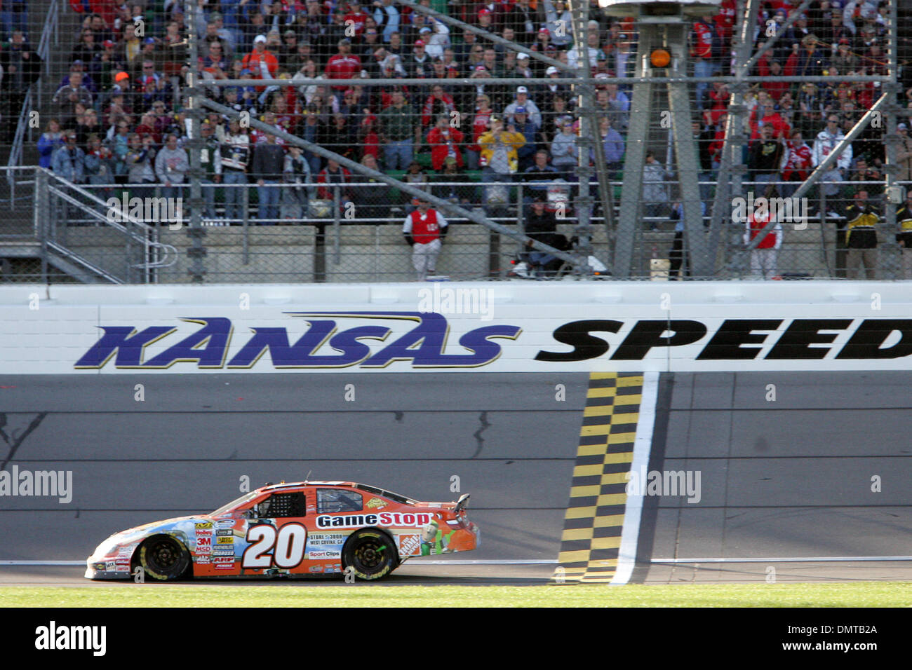 Nationwide Series driver Joey Logano #20 crosses the finish line ...