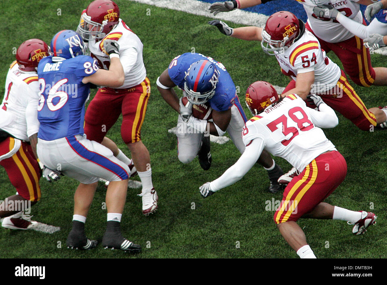 Kansas running back Toben Opurum (35) scrambles for yardage past Iowa ...