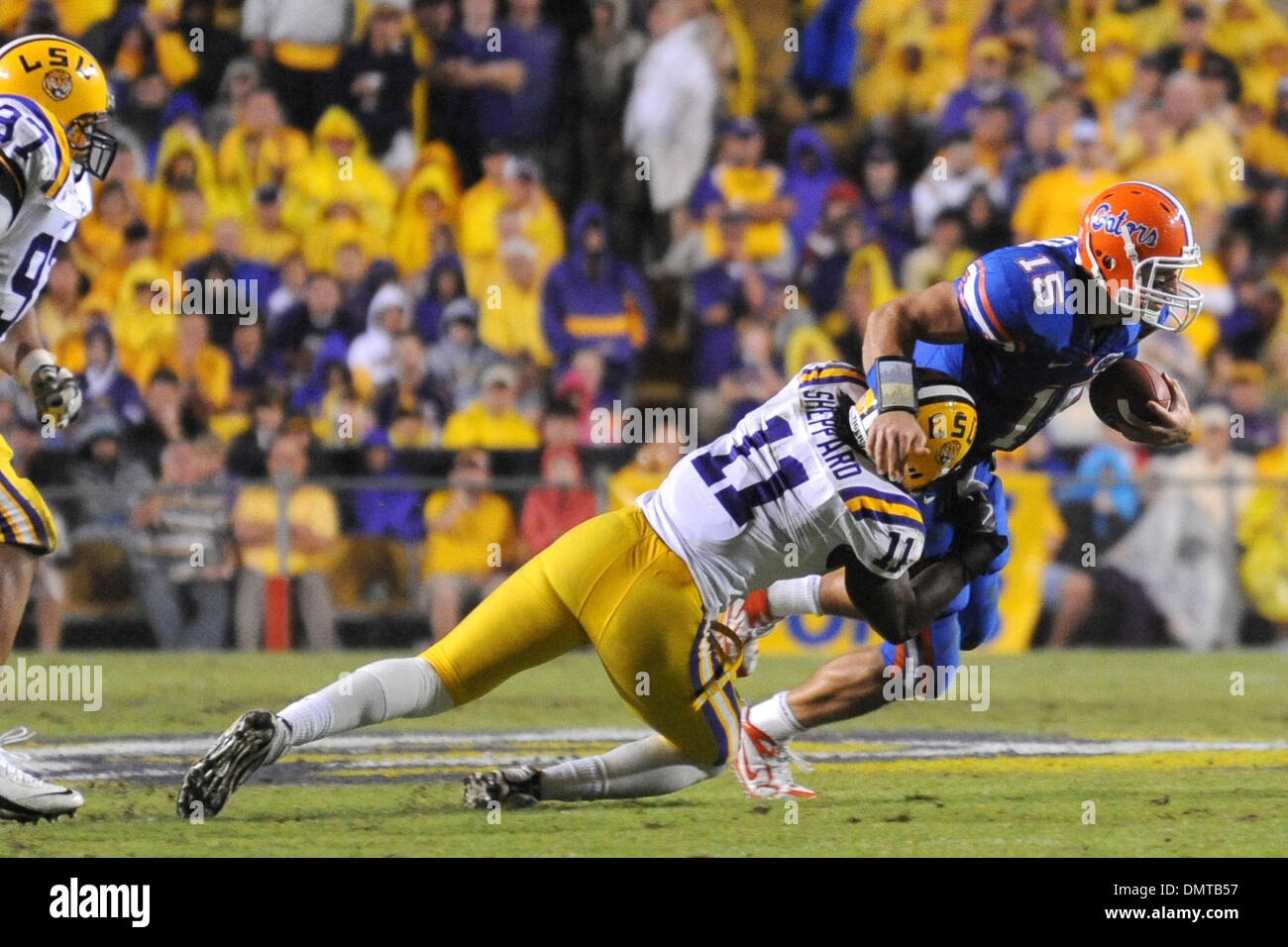 LSU linebacker #11, Kelvin Sheppard, tackles Florida quarterback #15 ...