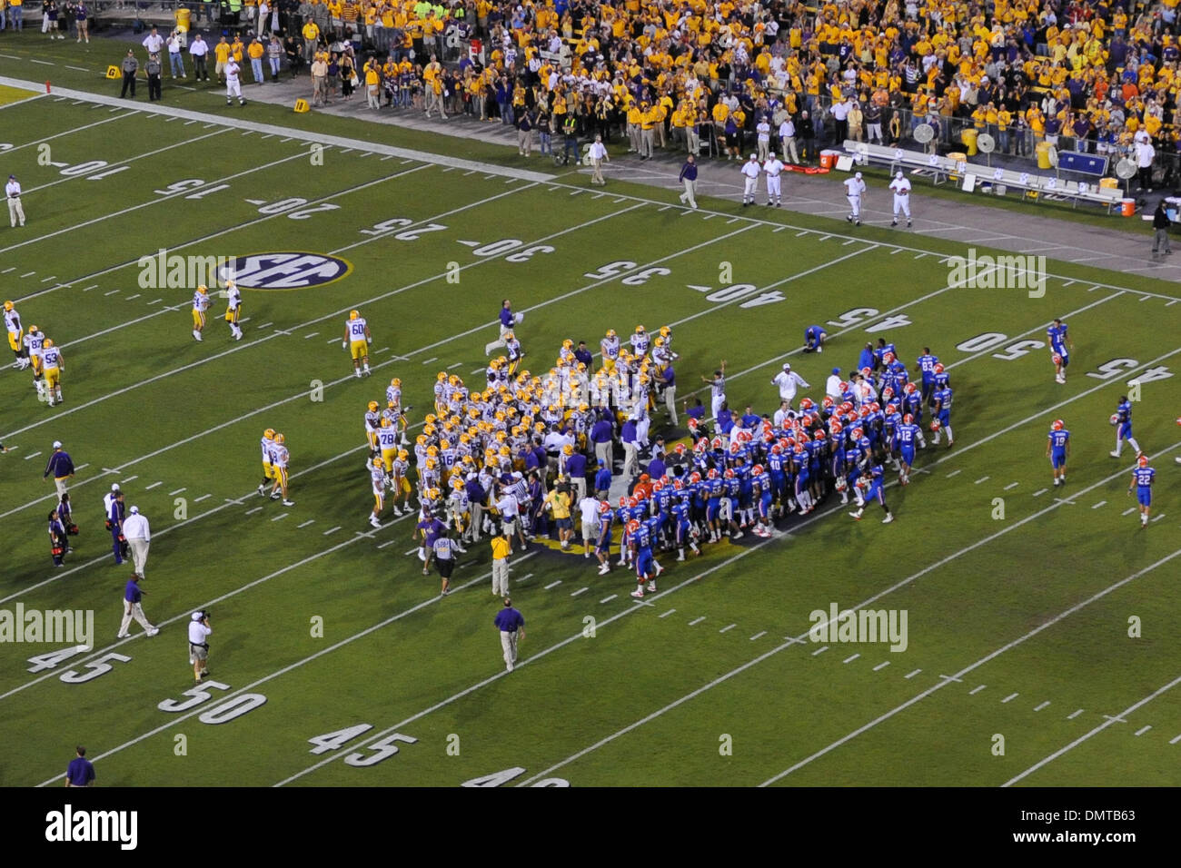 The LSU Tigers and Florida Gators meet at midfield prior to Saturday ...