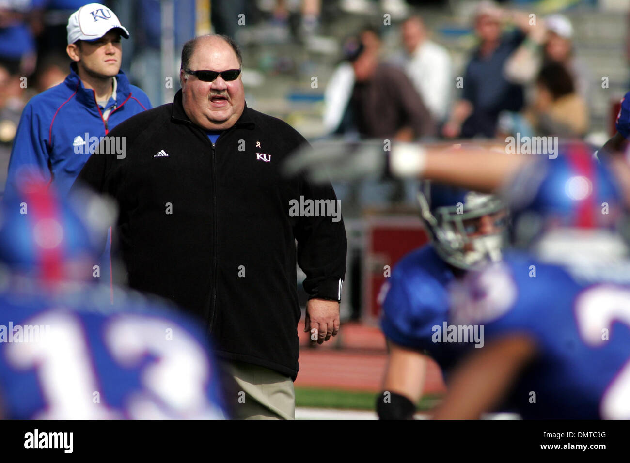 Kansas head coach Mark Mangino watches the linesmen warm up before ...