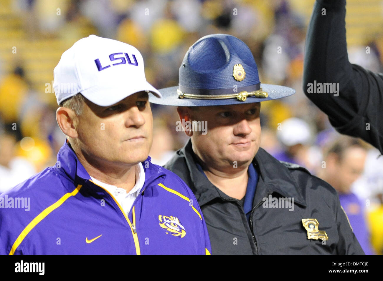 LSU head coach, Les Miles, walks to midfield following Saturday nights ...