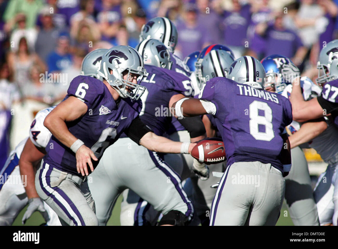 Kansas State quarterback Grant Gregory (6) hands off to Kansas State ...