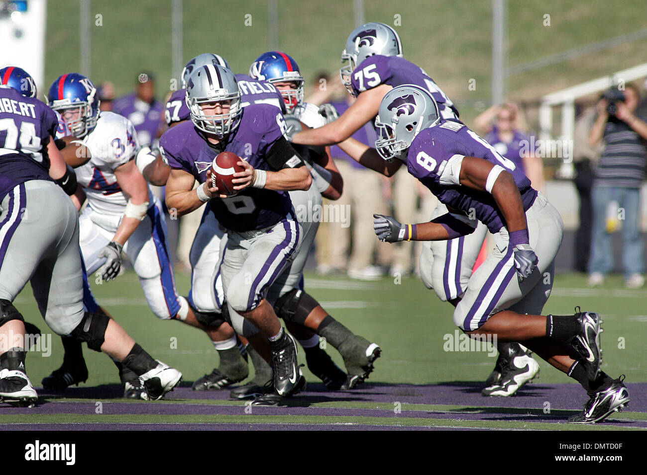 Kansas State quarterback Grant Gregory (6) hands off to Kansas State ...
